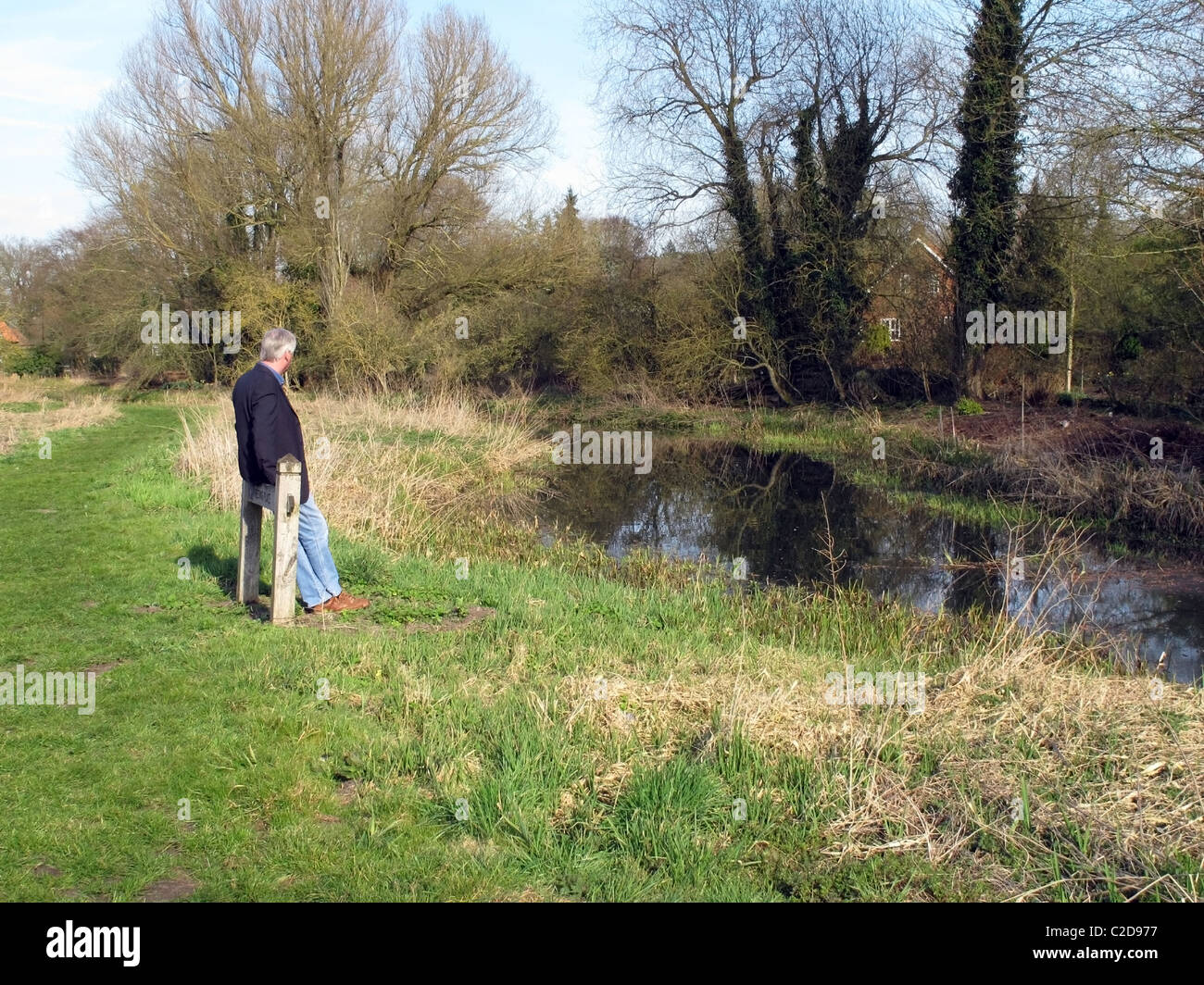 man beside river whitewater dereham norfolk england Stock Photo - Alamy