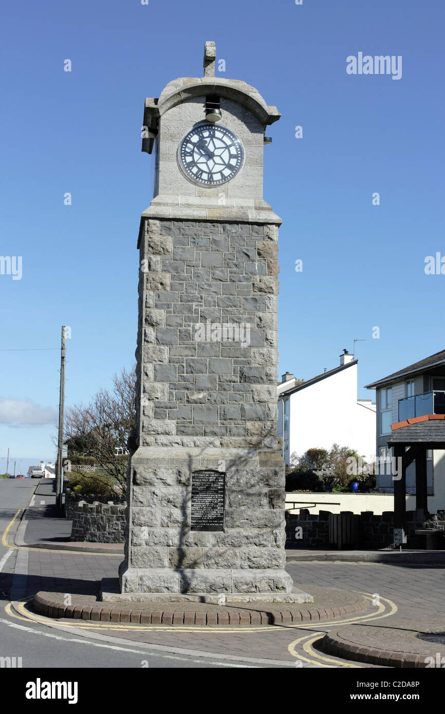 A war memorial in the form of a clock tower in the village of Rhosneigr ...