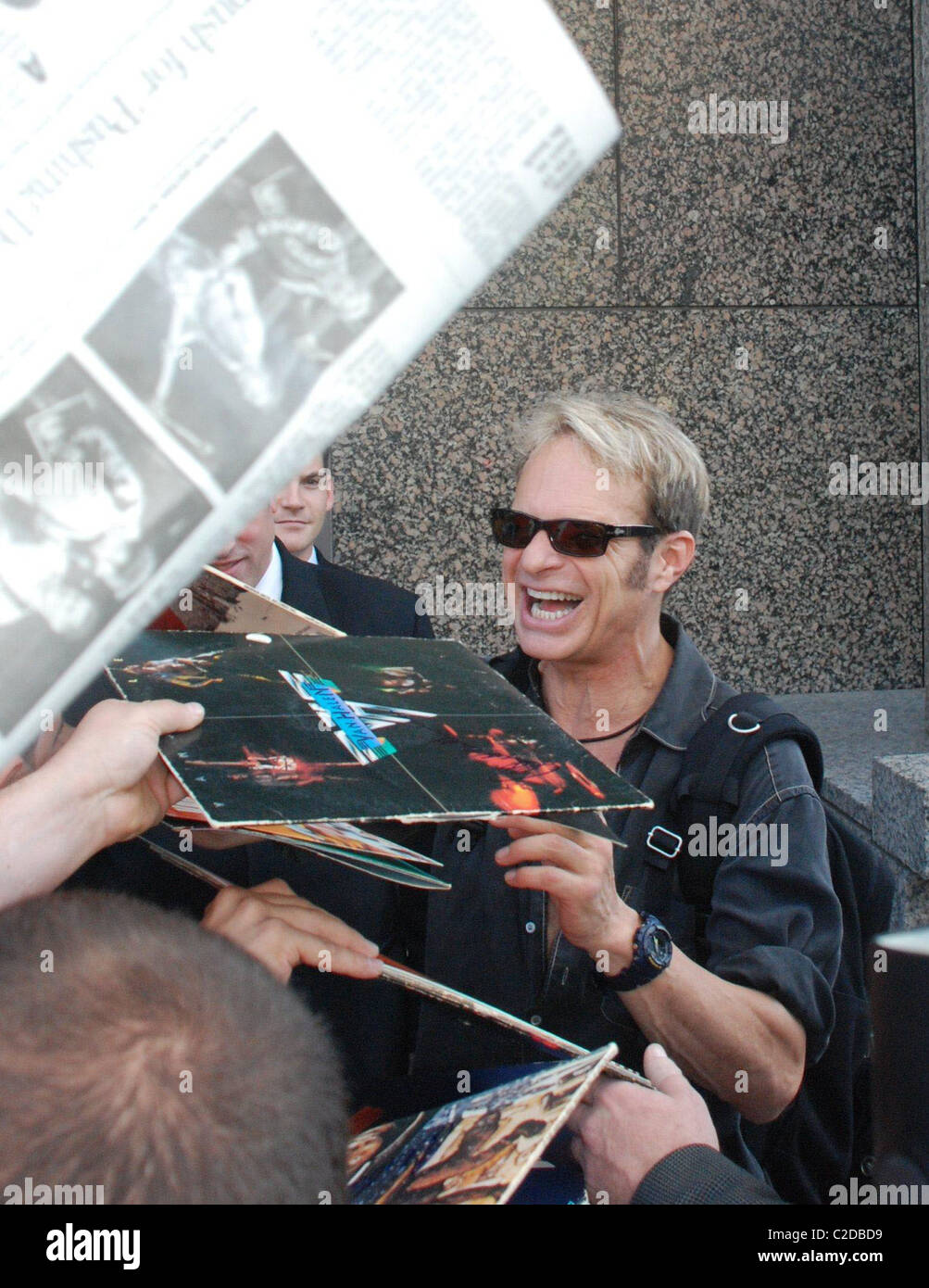 David Lee Roth signs autographs as he leaves his hotel in Philadelphia ...