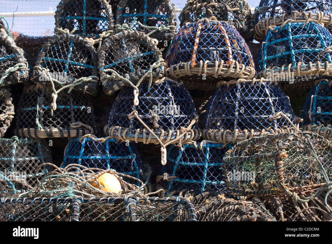 Lobster cages stacked up on a queyside Stock Photo - Alamy