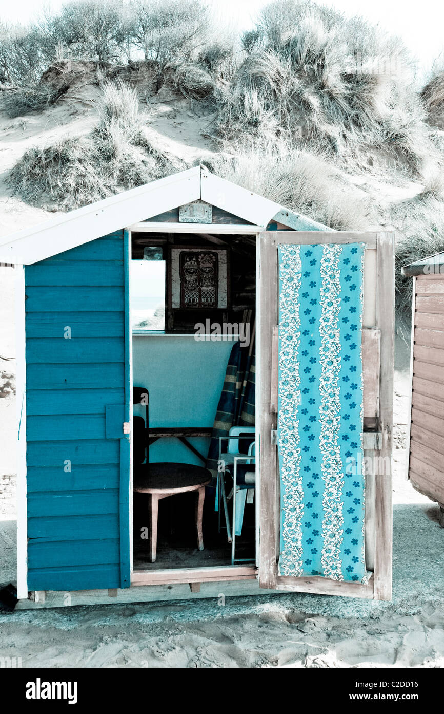 A washed out blue beach hut Stock Photo - Alamy