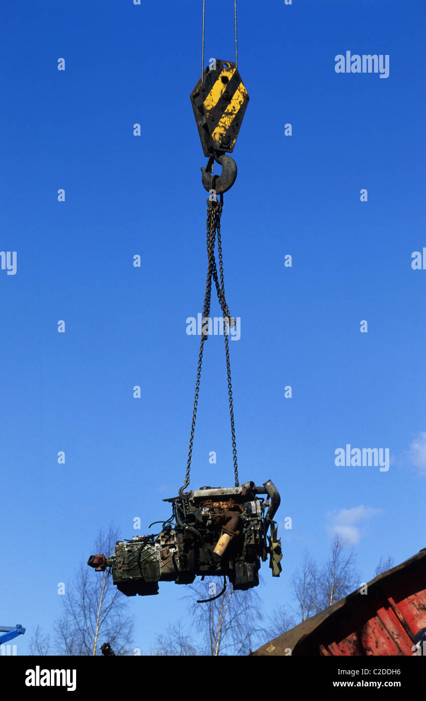 crane lifting large lorry engine for refurbishment at scrapyard uk ...