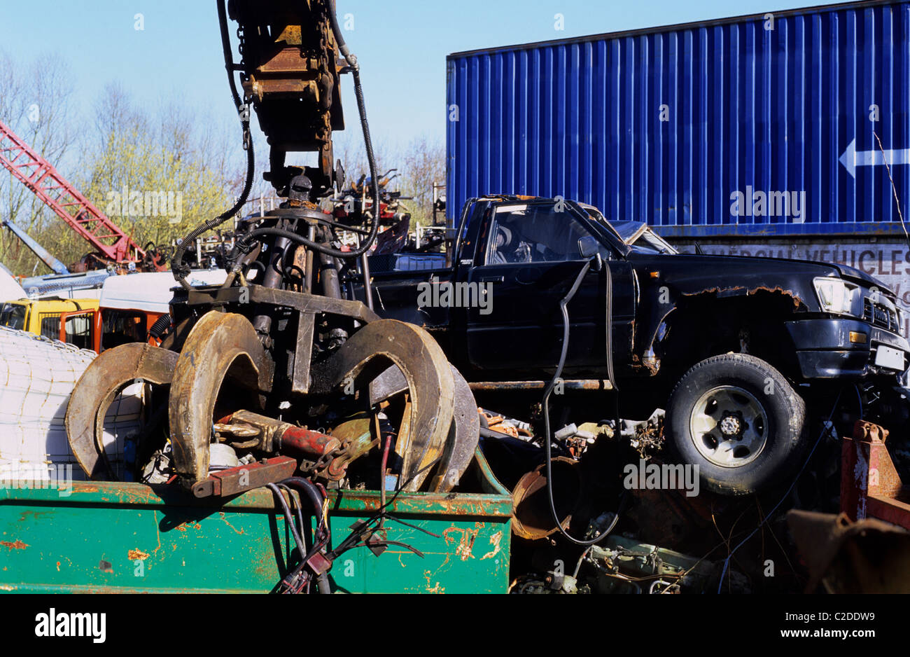 crane lifting large lorry engine for refurbishment at scrapyard uk ...