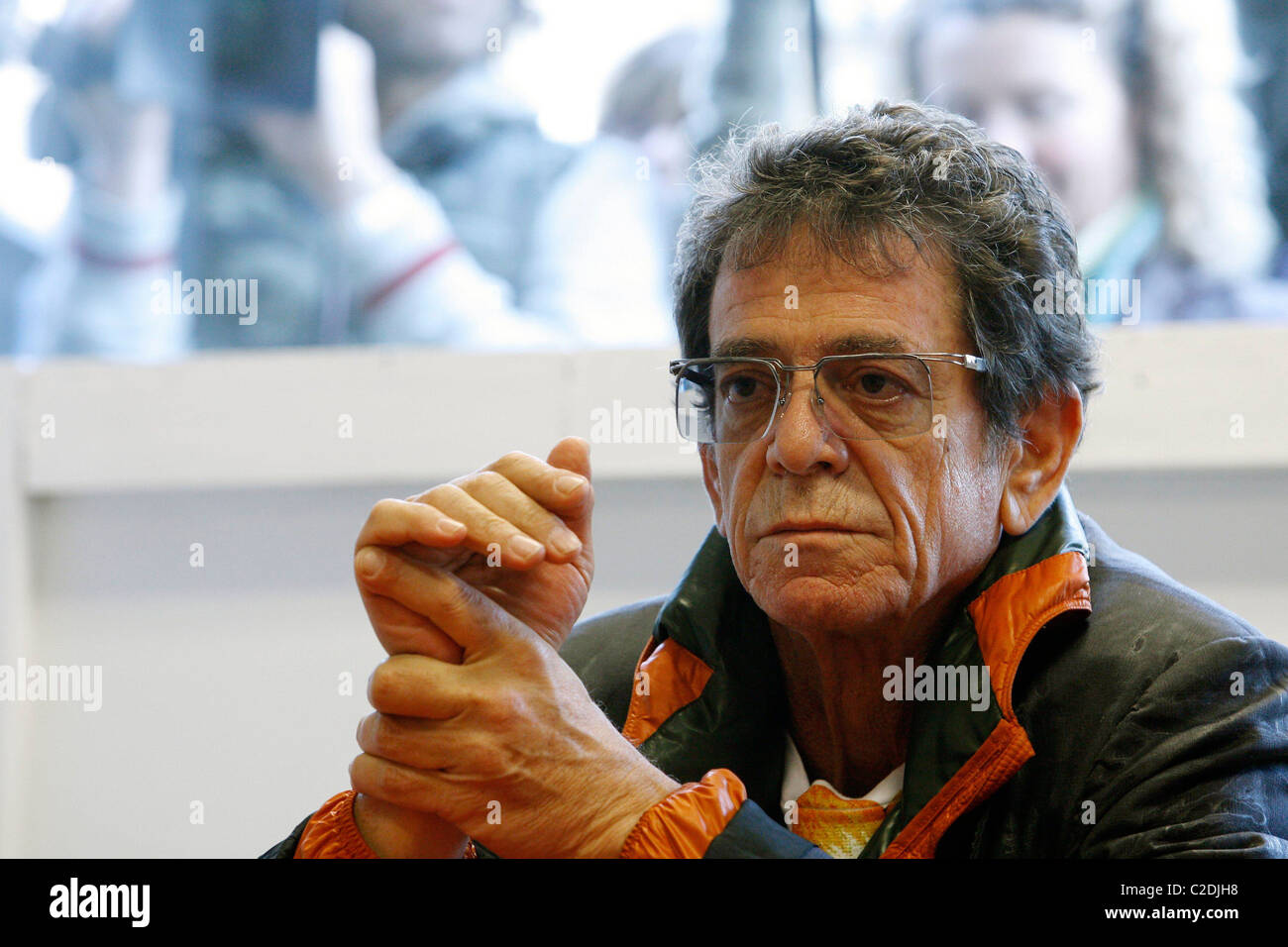 Musician, rock singer and photographer Lou Reed open his photo ...