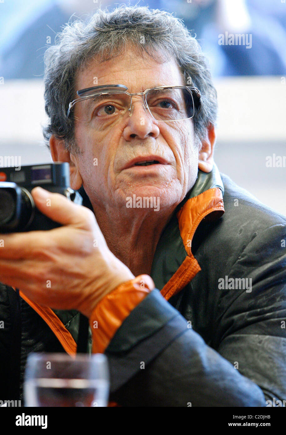 Musician, rock singer and photographer Lou Reed open his photo ...