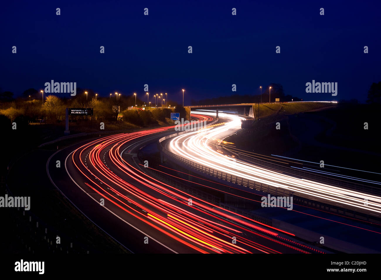 headlight trails of traffic travelling on the A1/M1 motorway at ...