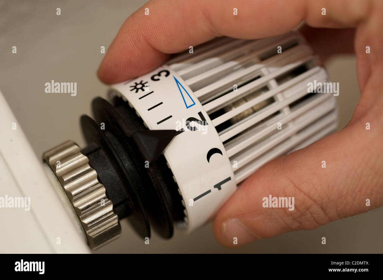 Household radiator heat control set to 2 or low heat Stock Photo - Alamy