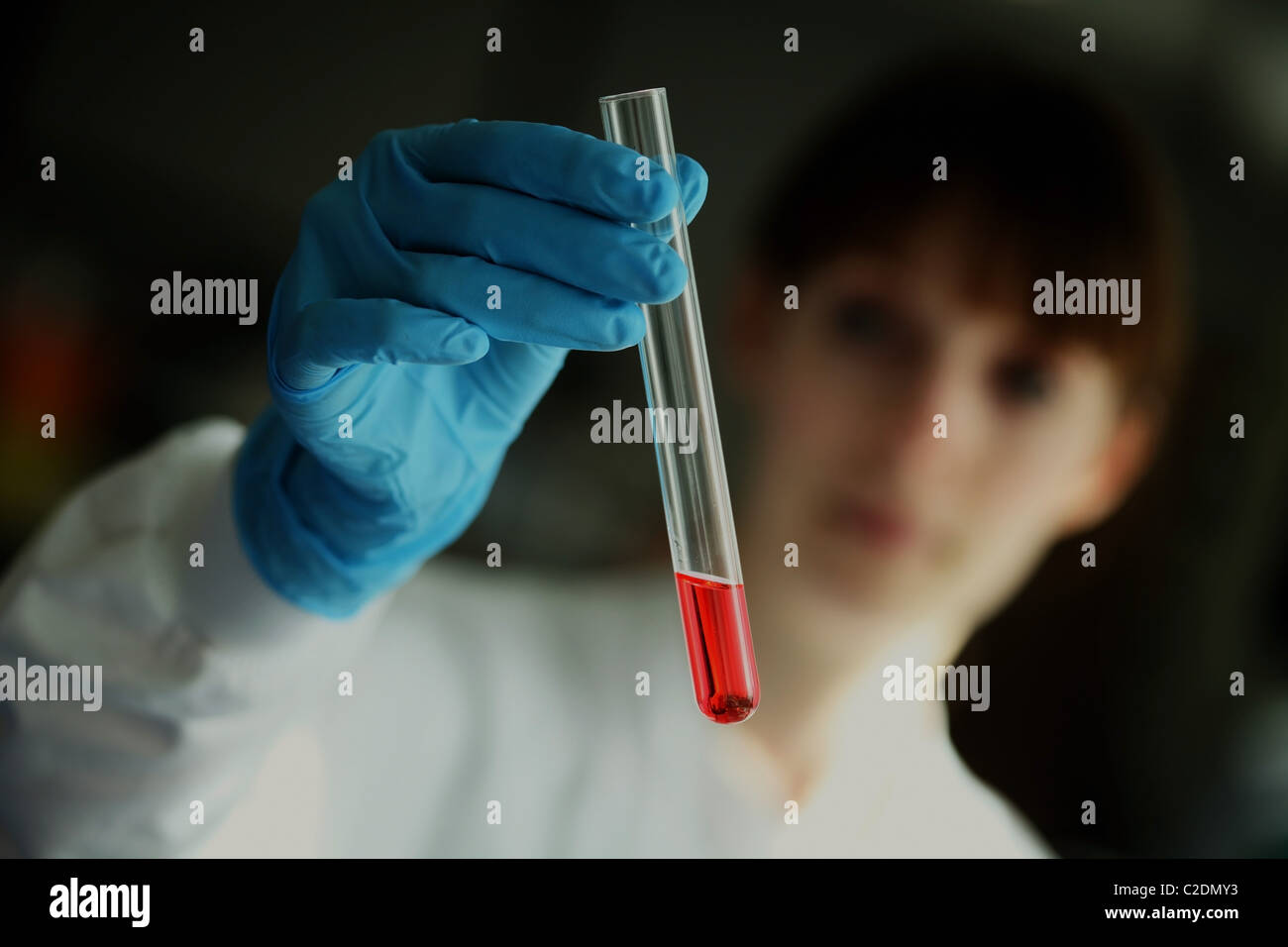 Laboratory technician/assistant, wearing a white lab coat and blue ...