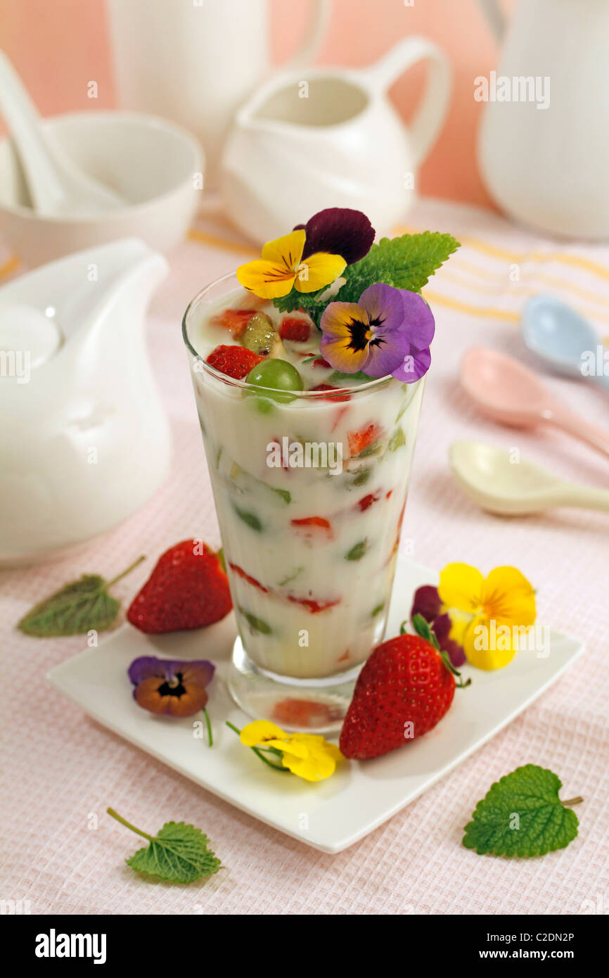 Kefir with fruits and flowers. Recipe available Stock Photo - Alamy