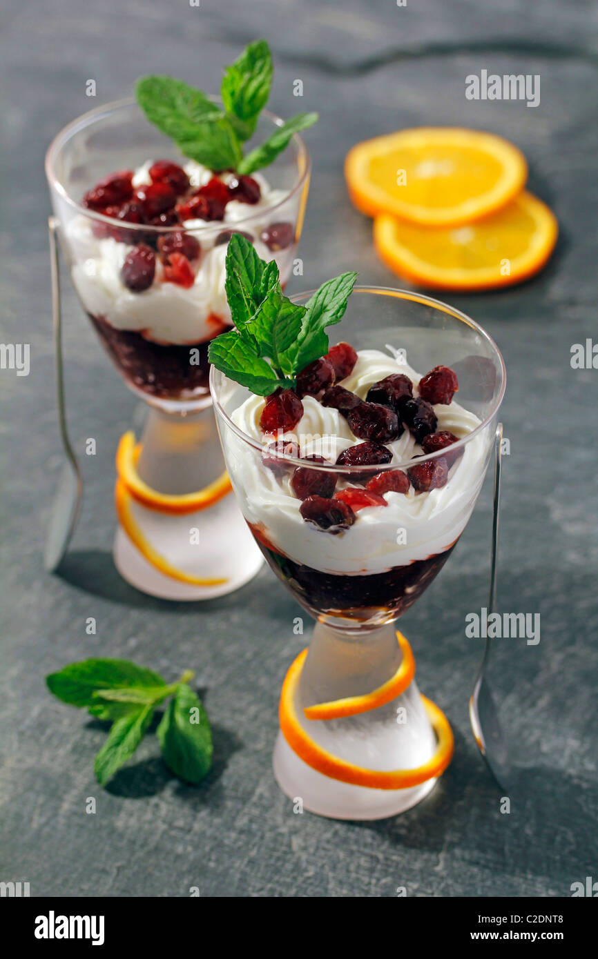 Yogurt with cranberries. Recipe available Stock Photo - Alamy