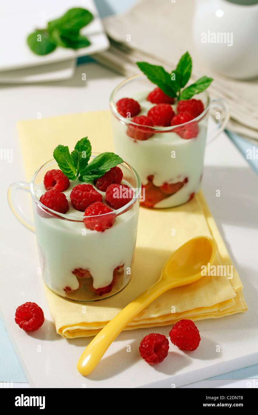 Pistachios yogurt with raspberries. Recipe available Stock Photo - Alamy
