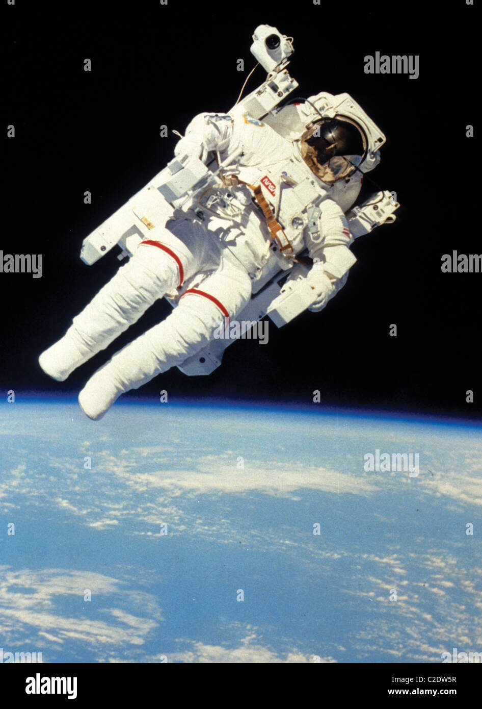 Astronaut in space suit floating in space Stock Photo - Alamy