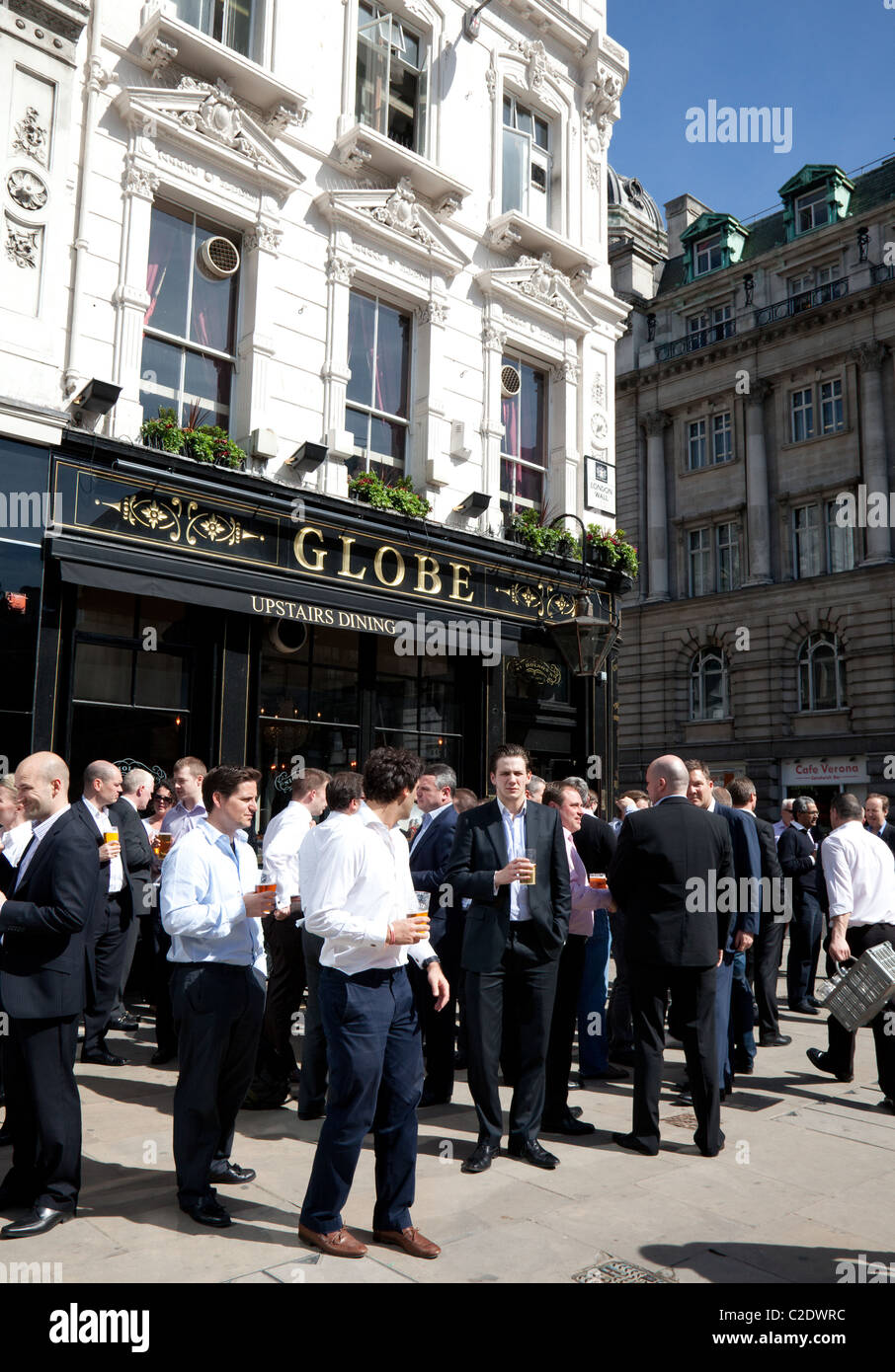 City workers drinking at lunchtime outside pub, London Stock Photo - Alamy