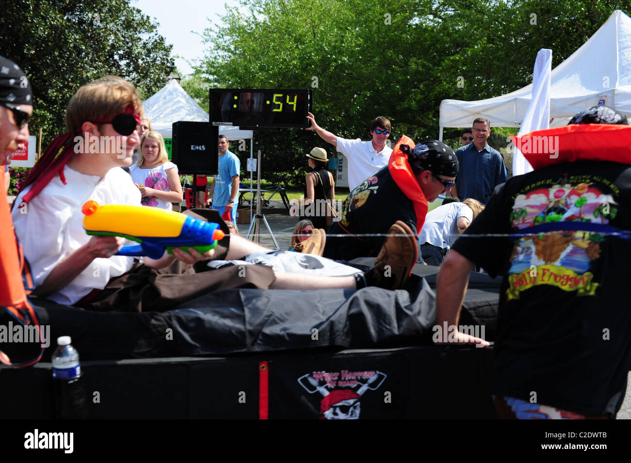 Bed Racer team Pirate rushing to finish line Stock Photo - Alamy