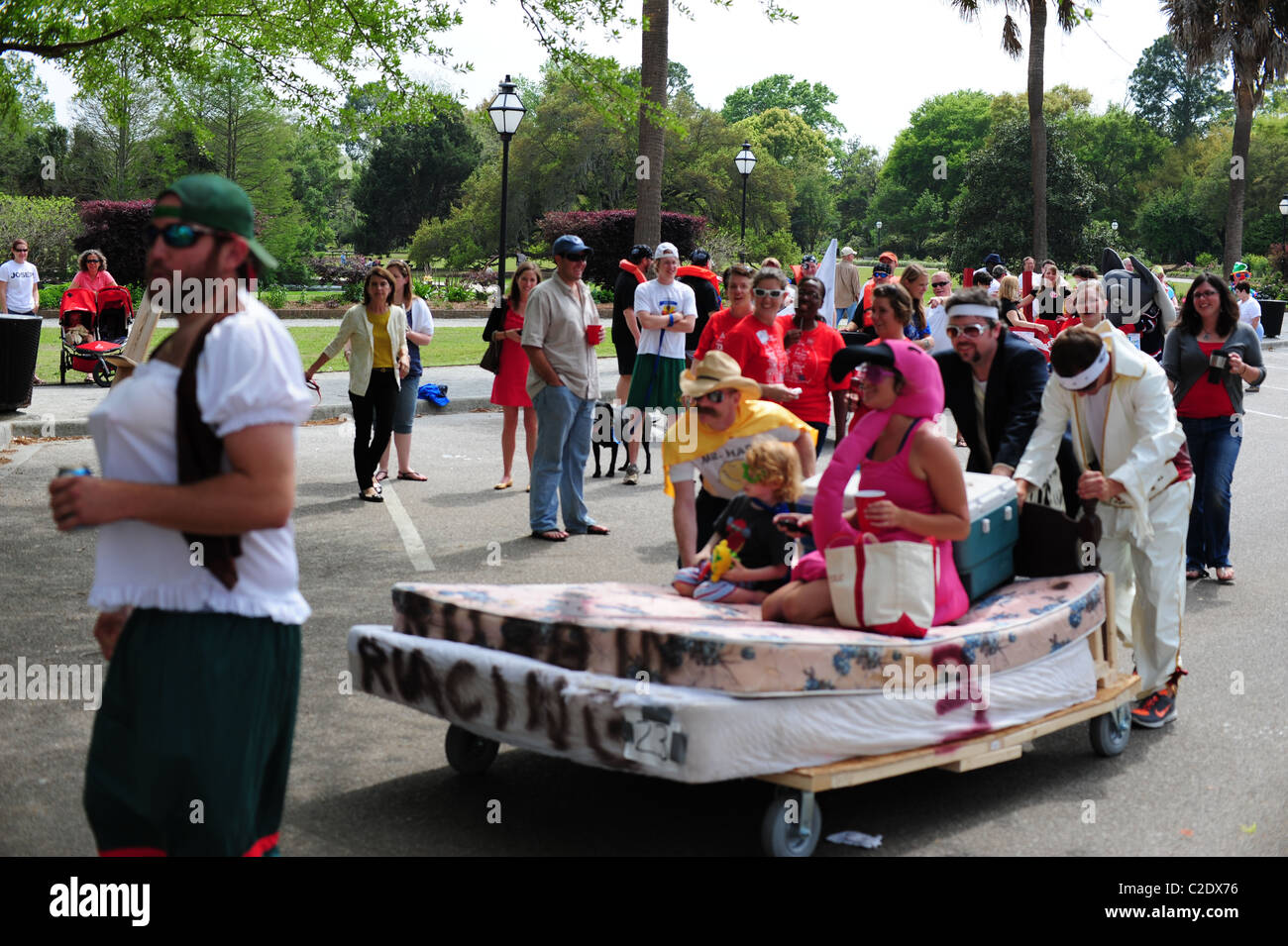 Bed Racer team racing for charity event Stock Photo - Alamy
