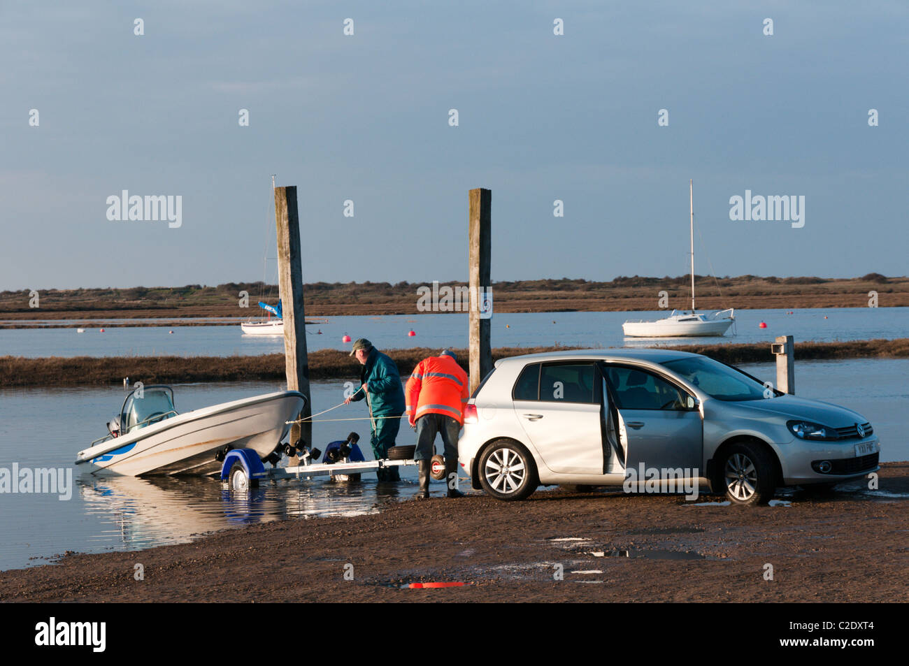 Loading a boat onto a car trailer at the end of the day on the North ...