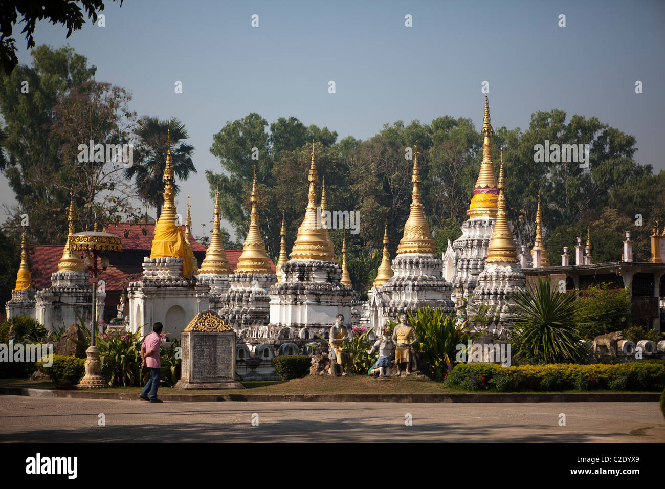 Thai man walk around many Chedi, This temple is famous about many Chedi ...