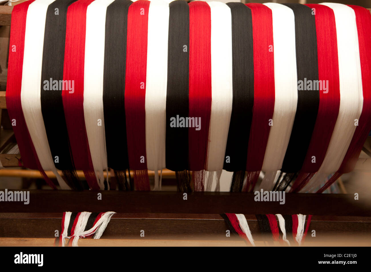 Northern Thai style weave loom with pattern of traditional color ...