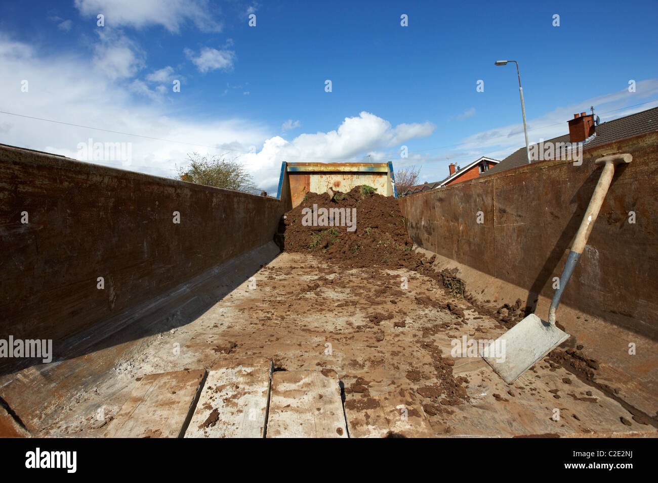large roll on off building skip containing some soil and garden waste ...
