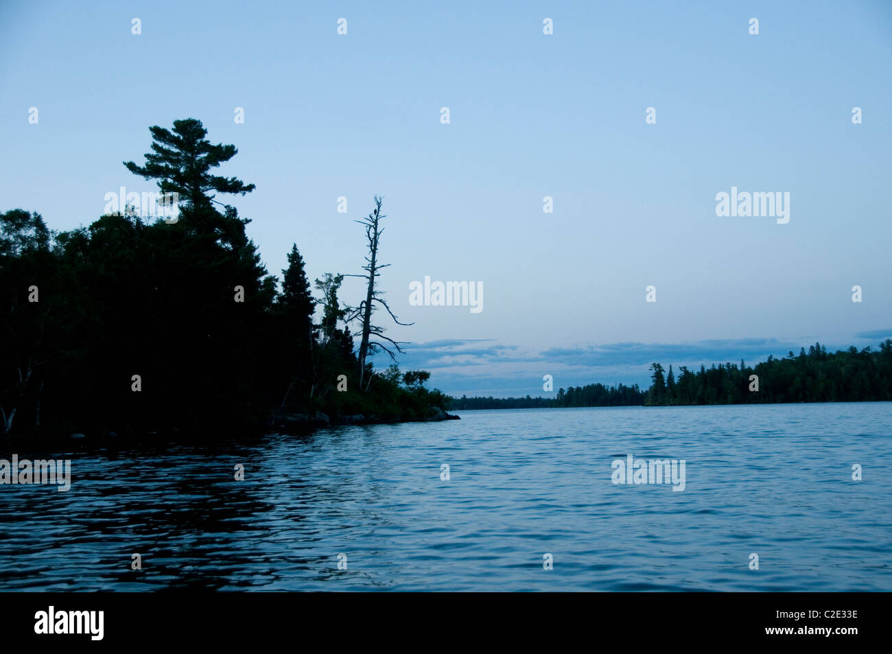 Lake Of The Woods, Ontario, Canada; Sunset Over Placid Lake Stock Photo ...