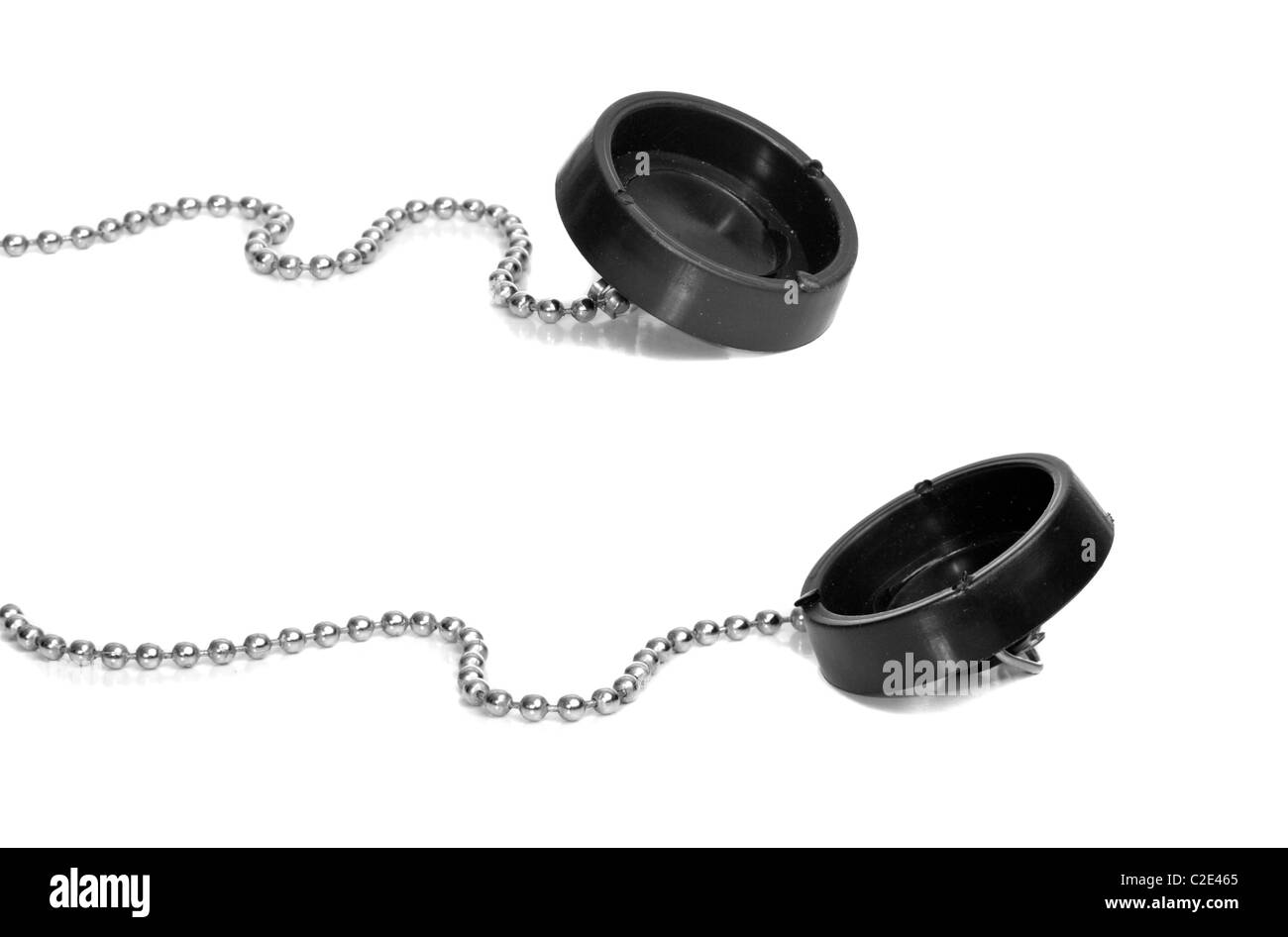 Two draining water caps for washbasin isolated on white background ...