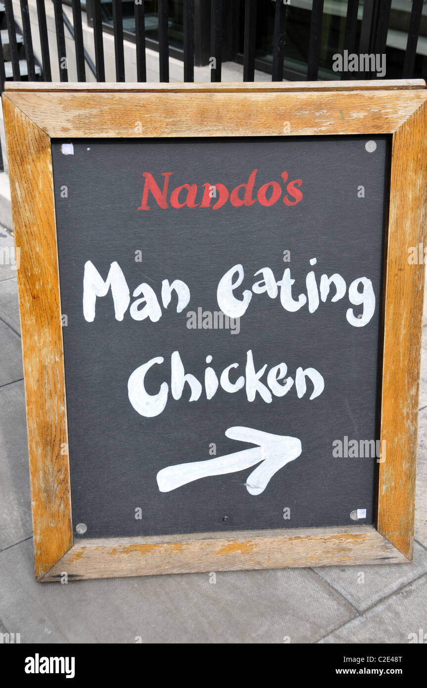 Nando's Peri Peri Chicken restaurant sign with funny caption "man ...