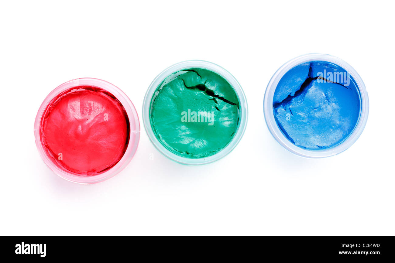 three paint cans isolated on white background Stock Photo - Alamy