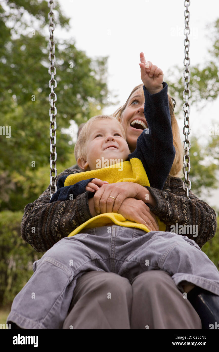 Mother And Son On A Swing Stock Photo - Alamy