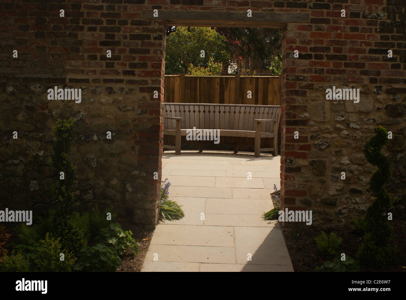 Walkway in summer with bench Stock Photo - Alamy
