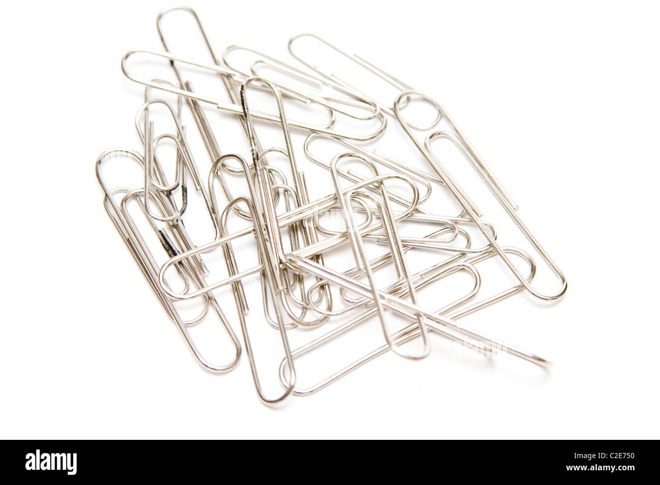 Untidy pile of paperclips over a white background Stock Photo - Alamy