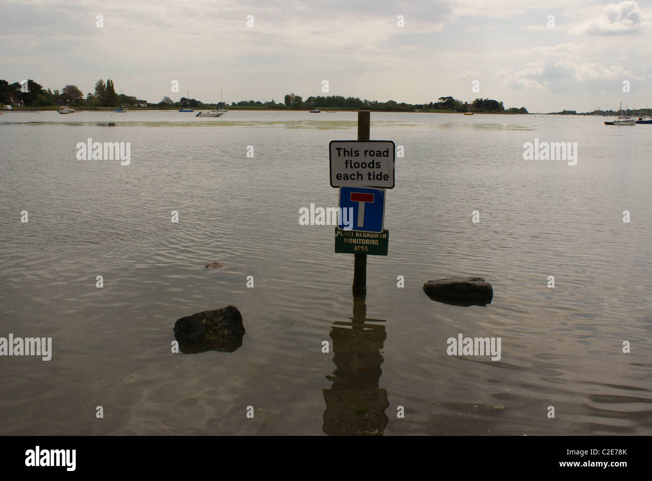 Road flooding sign immersed in water Stock Photo - Alamy