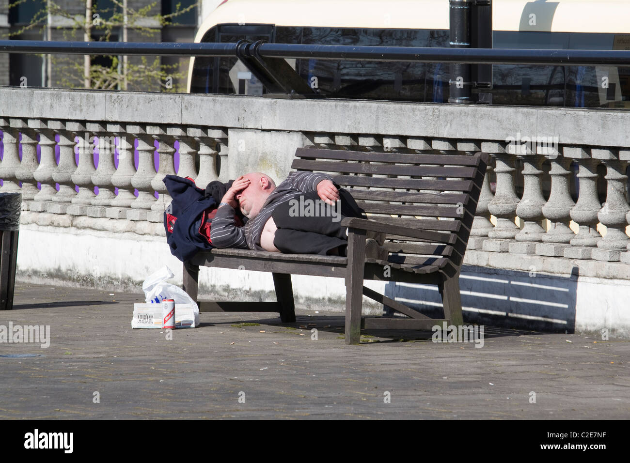 Man asleep on bench hi-res stock photography and images - Alamy