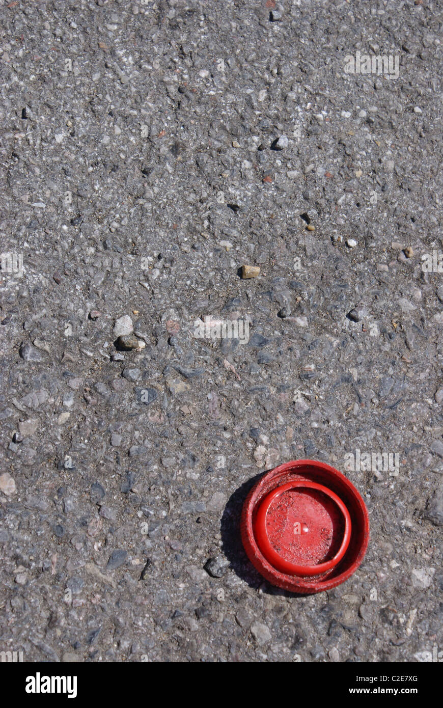 Red lid on road Stock Photo - Alamy