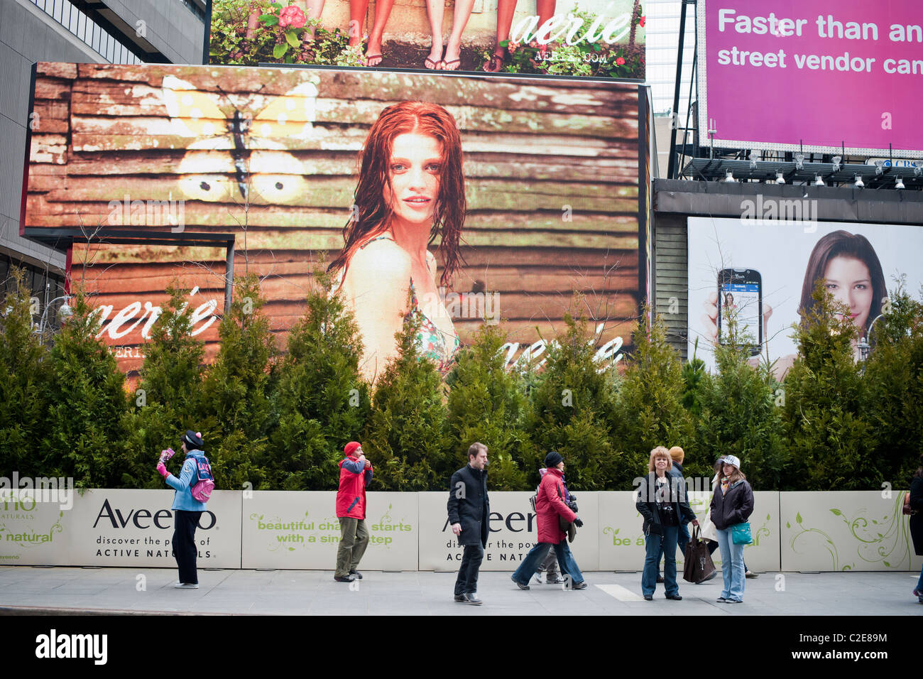 Visitors walk through a "pop-up forest" in Times Square in New York ...