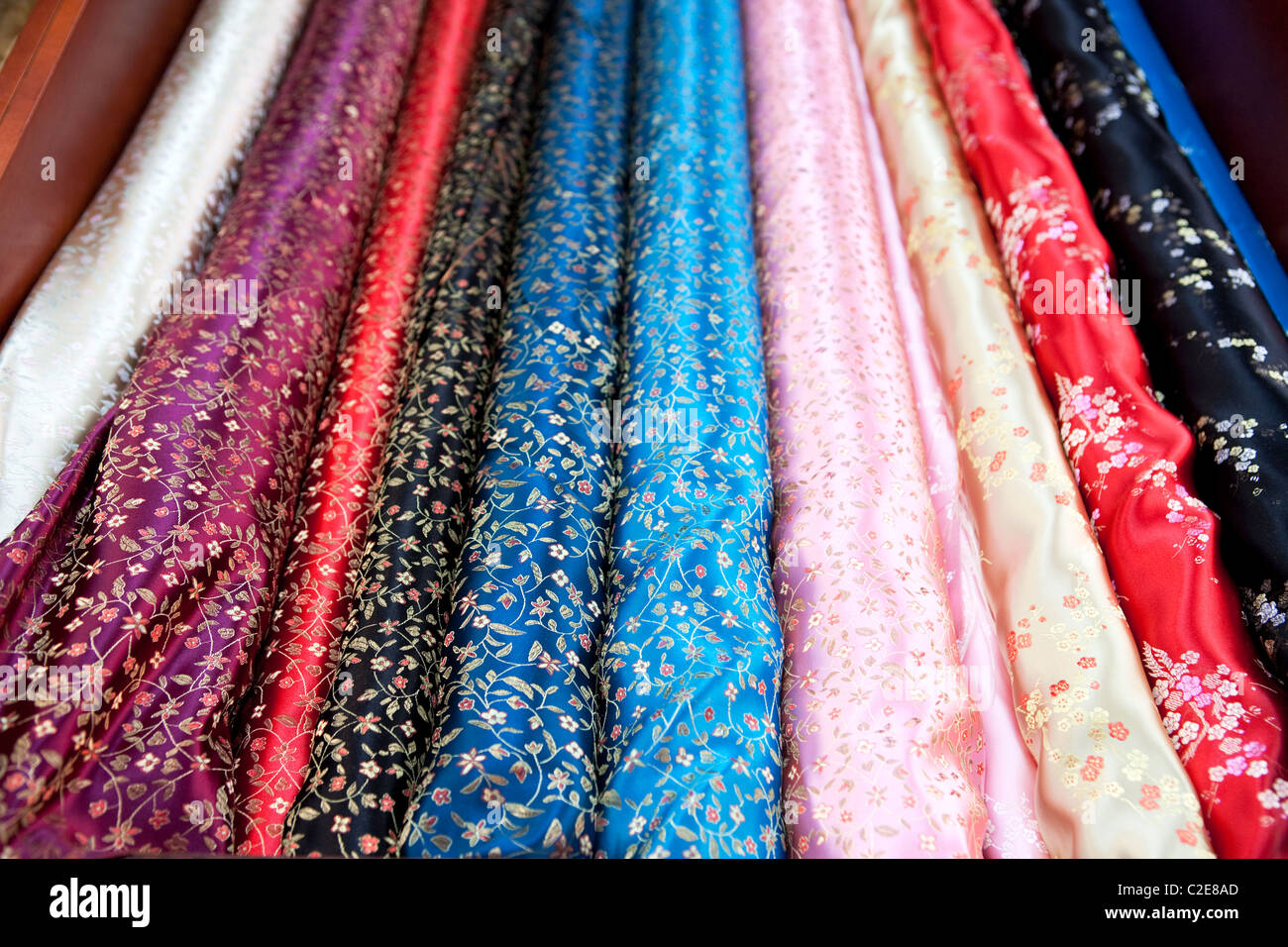 A collection of asian cloth on the roll Stock Photo - Alamy
