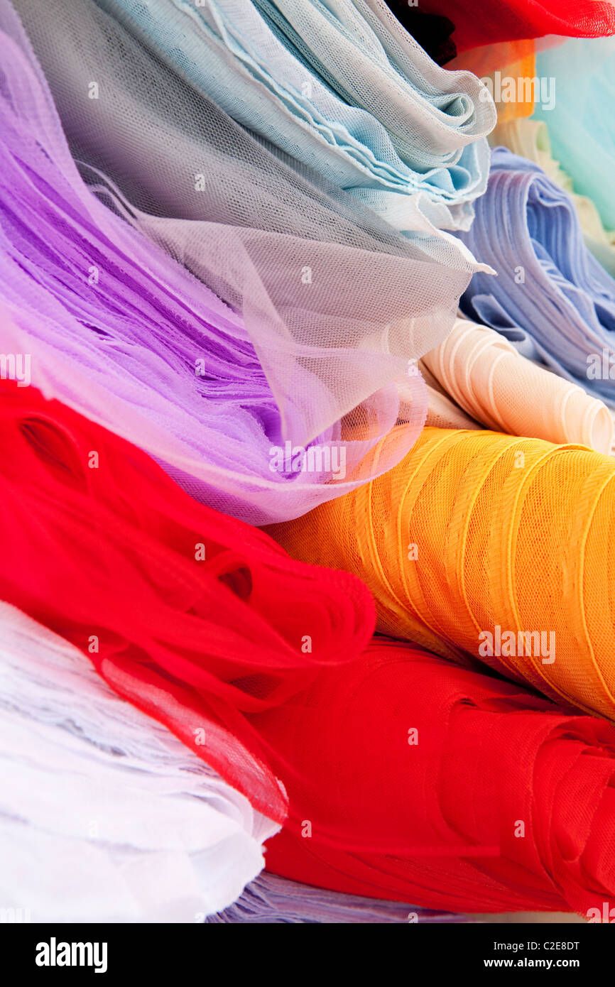 A background of various rolls of cloth Stock Photo - Alamy