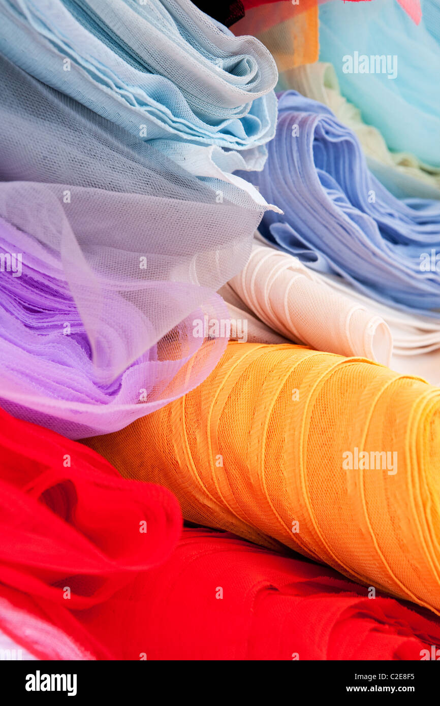 A background of various rolls of cloth Stock Photo - Alamy