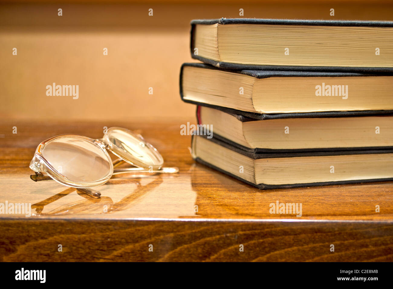 glasses and closed books on a table Stock Photo - Alamy