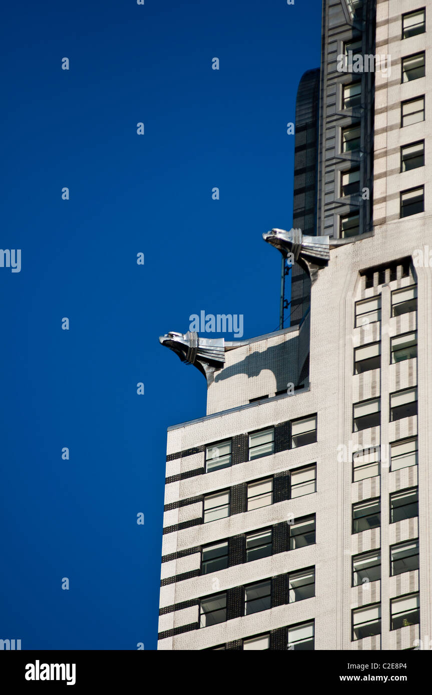 Chrysler building steel spire with gargoyles, blue sky background ...