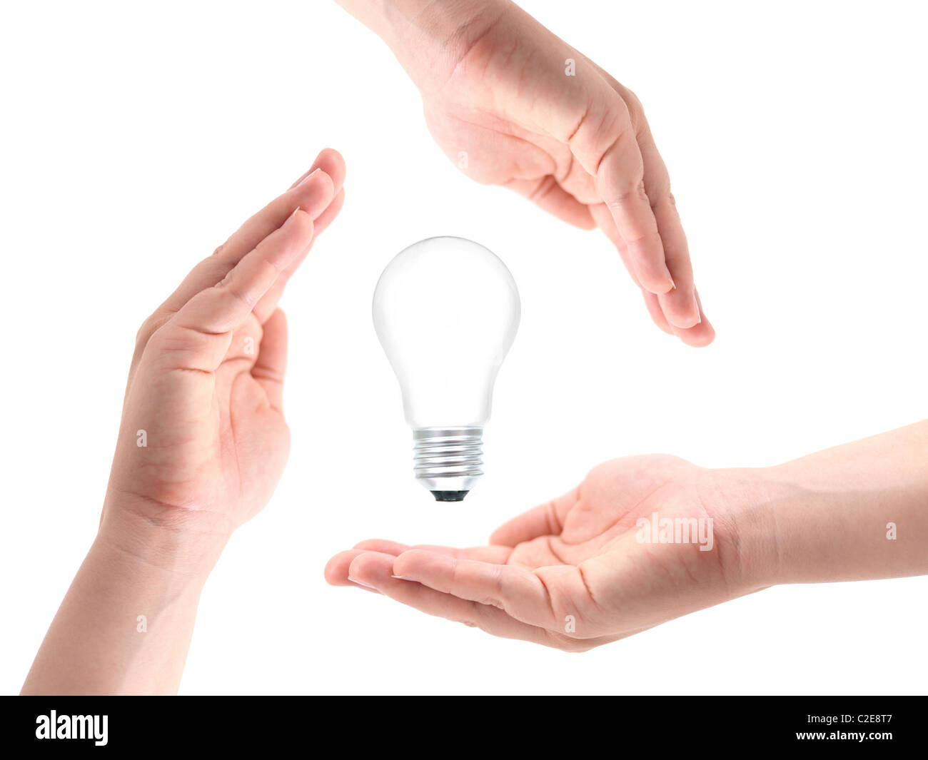 Female hands protecting a clear light bulb Stock Photo - Alamy