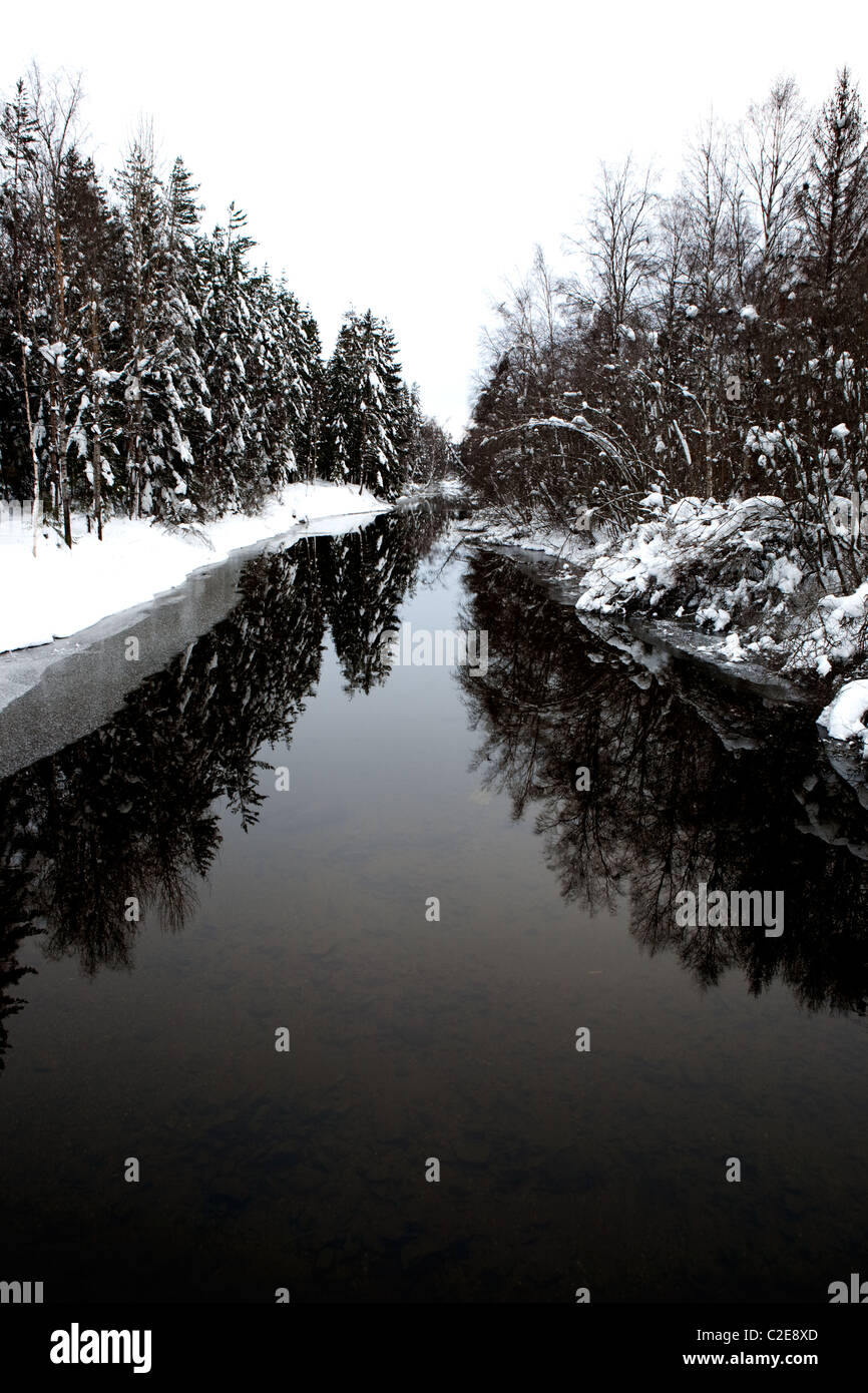 A cold winter river with a grey sky Stock Photo - Alamy
