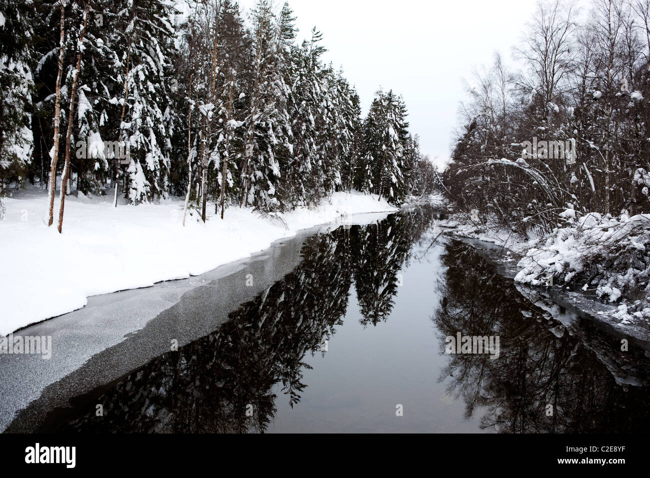 A cold winter river with a grey sky Stock Photo - Alamy