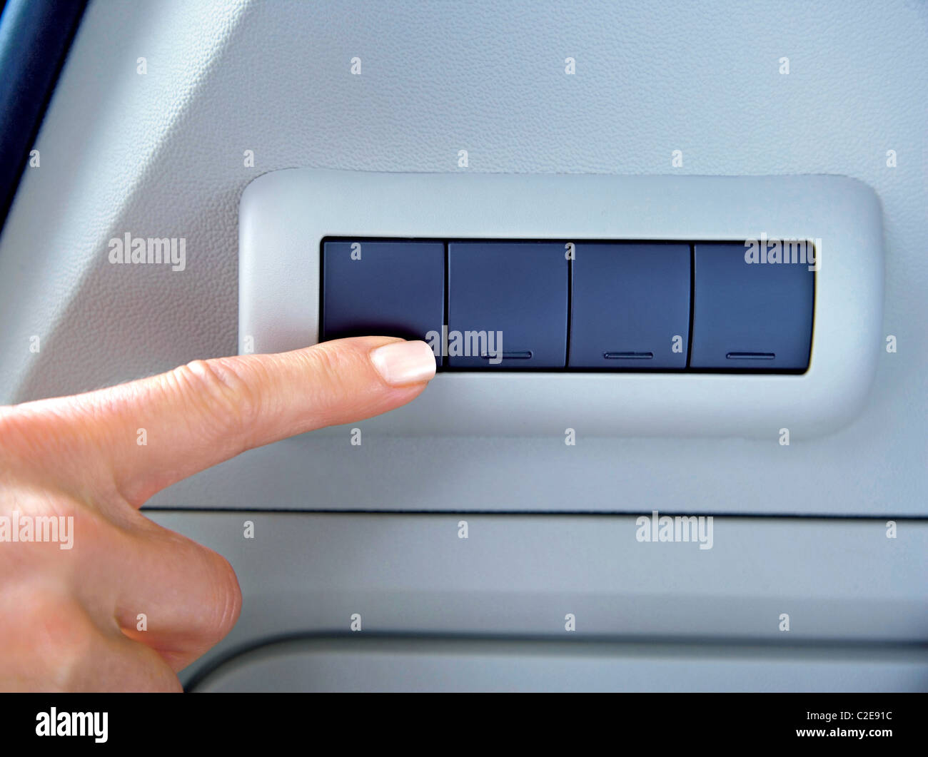 finger on buttons of device in a car Stock Photo - Alamy
