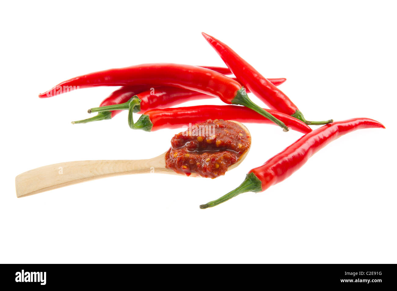 Fresh red hot chili peppers and glass pot of paste Stock Photo - Alamy