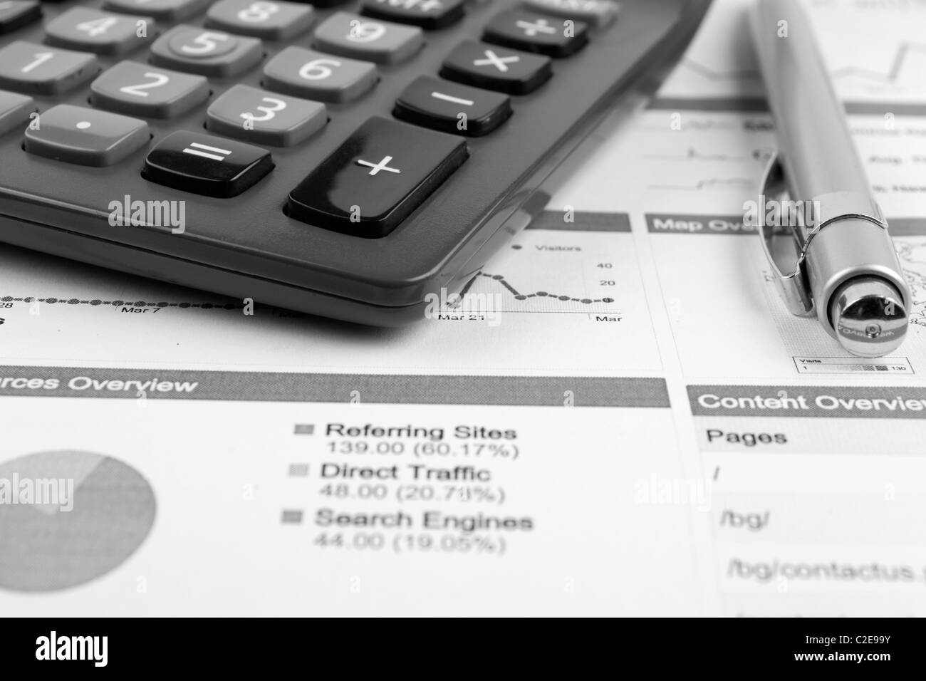 Paperwork concept with charts, calculator, pen Stock Photo - Alamy