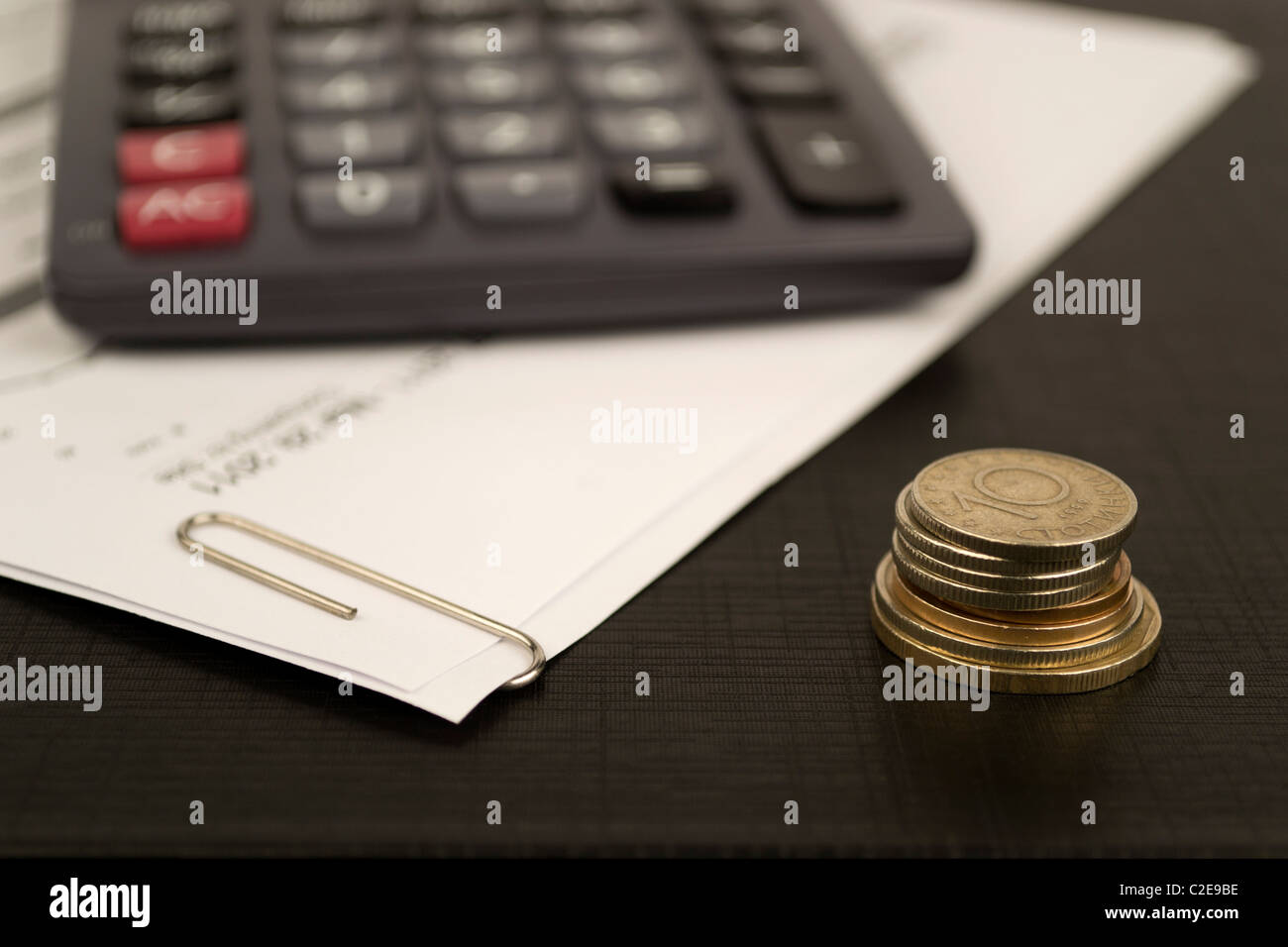 Paperwork concept with charts, calculator, coins Stock Photo - Alamy