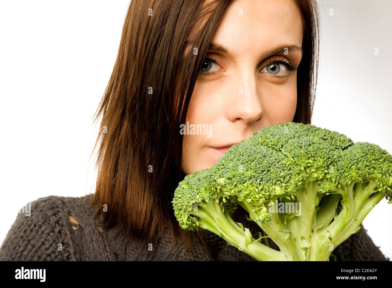 A woman with broccoli in hand Stock Photo - Alamy