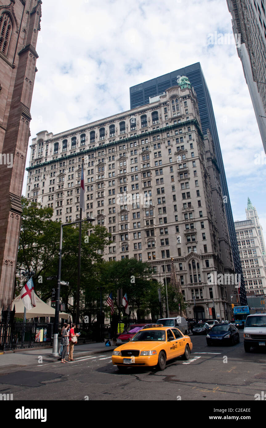 Yellow Taxi Cab on Broadway with Trinity Building in the background ...