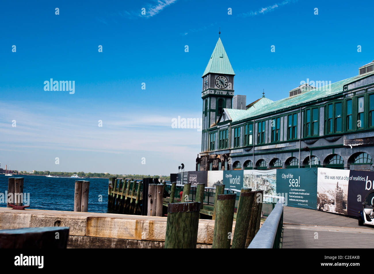 City Pier A with clock tower, blue sky background, Battery Park ...