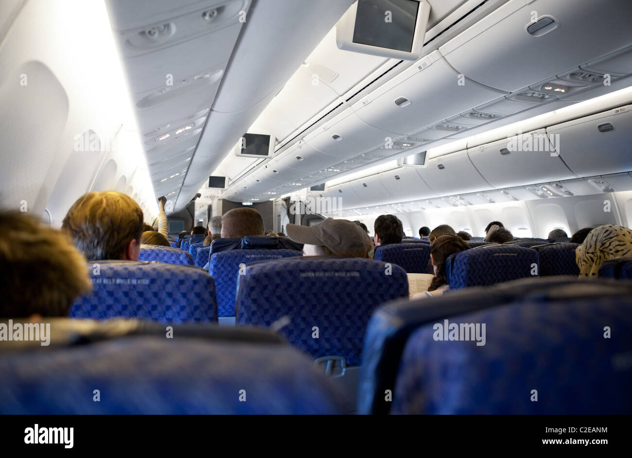Interor of a passenger airplane - commercial airline Stock Photo - Alamy